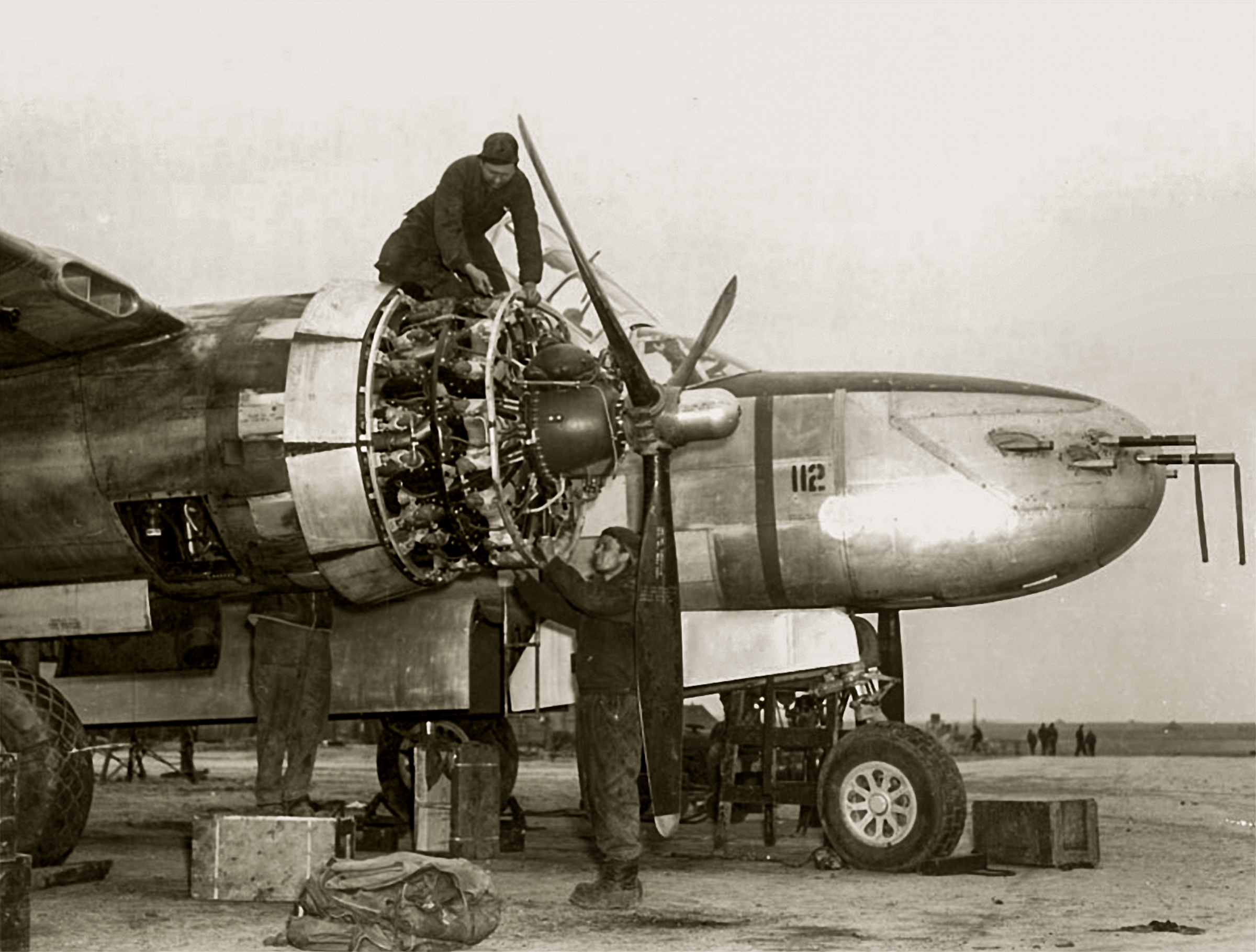 Asisbiz A 26B Invader 9AF 386BG555BS YA under going engine maintenance 1